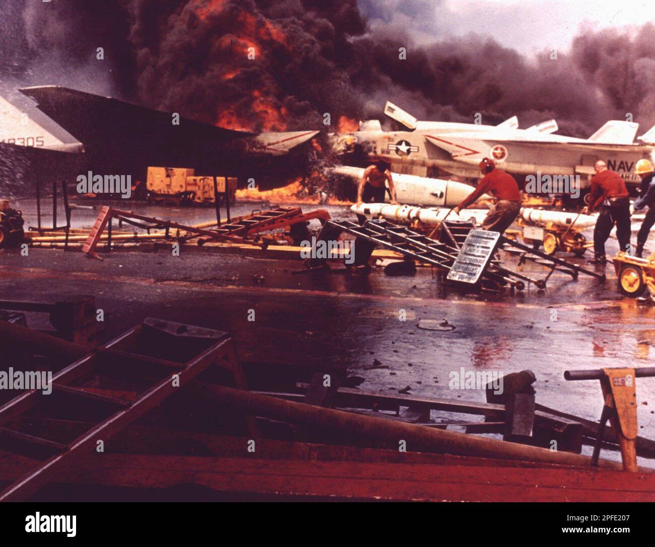 The USS Forrestal with burning planes on deck, is shown in this 1967 ...