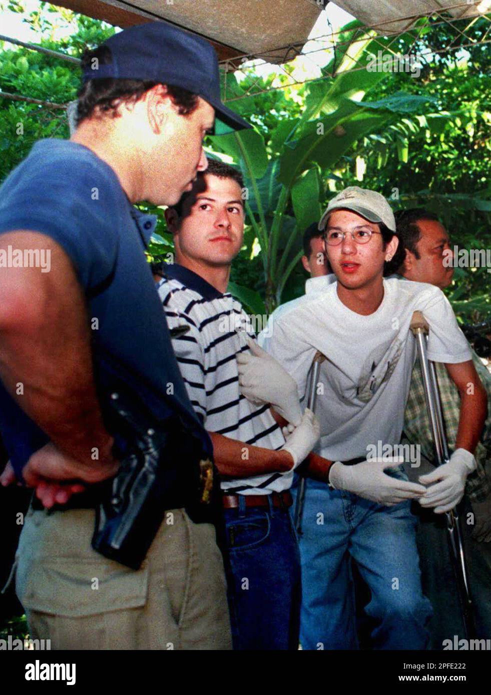 Andres Suster, right, talks with National Civil Police (PNC) Chief ...
