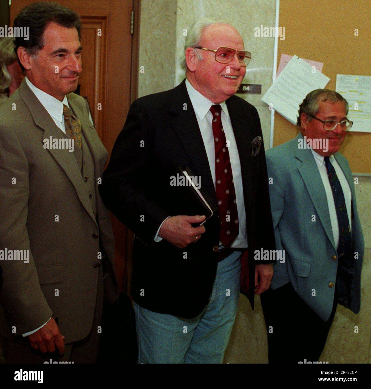 Actor Carroll O'Connor, center, exits a Los Angeles courtroom with Ron ...