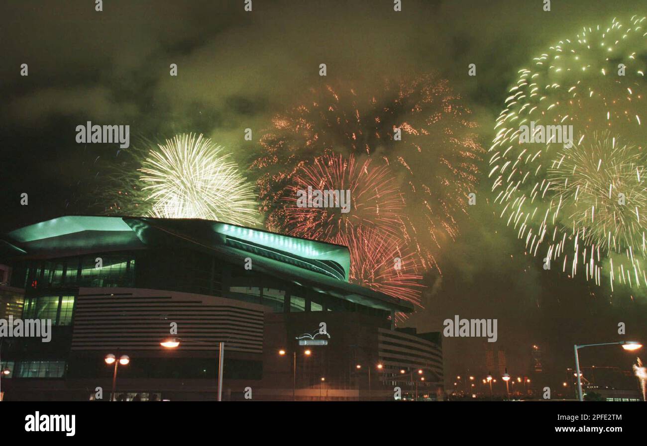 Fireworks explode over the Hong Kong Convention Center where Hong Kong ...