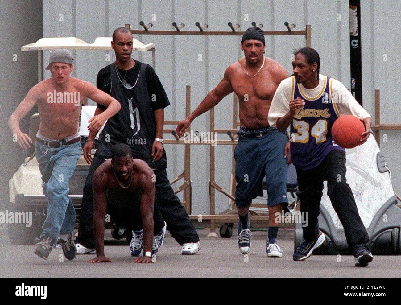 Rap star Snoop Doggy Dog, right, stays loose before his performance at ...