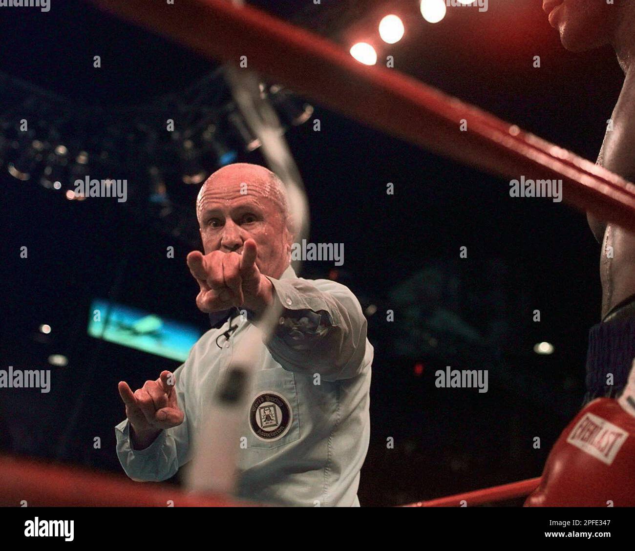 Referee Mills Lane signals a two point deduction toward one of the ...