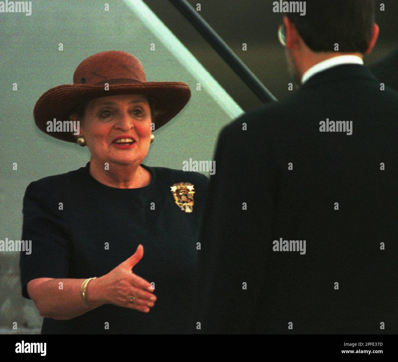 Secretary of State Madeleine Albright is greeted by U. S. officials ...