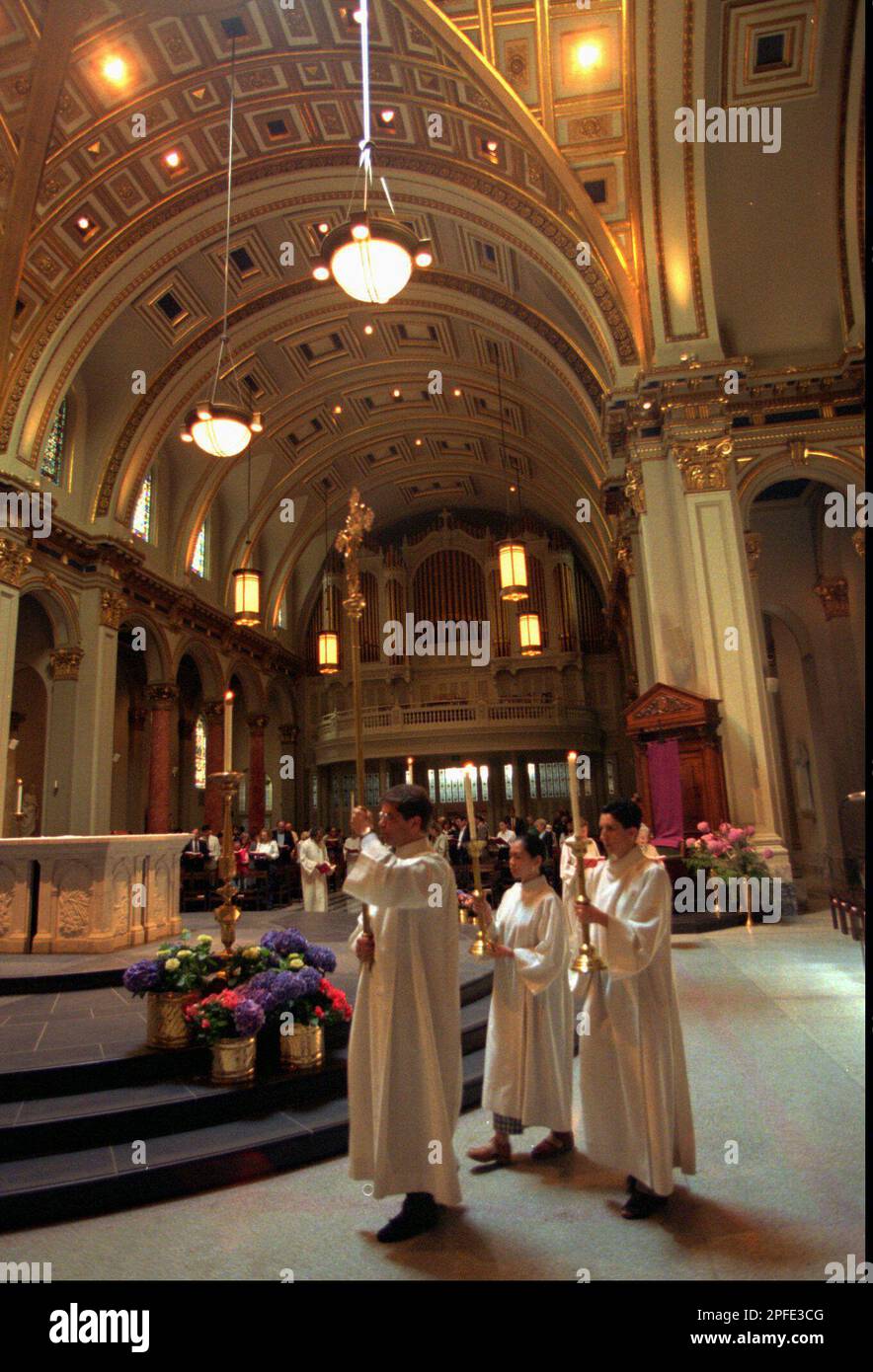 Members of St. James Cathedral celebrate Mass Thursday, June 26, 1997 ...