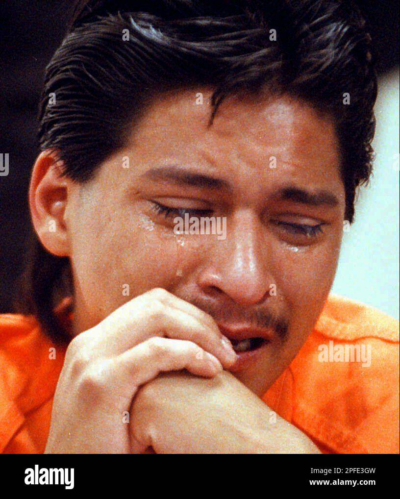 Kris Delgado sobs during his first appearance in Racine, Wis., County ...