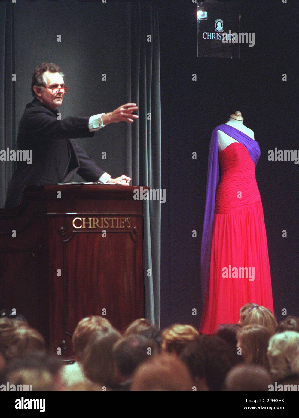 An auctioneer for Christie's Auction house takes a bid on the fifth ...