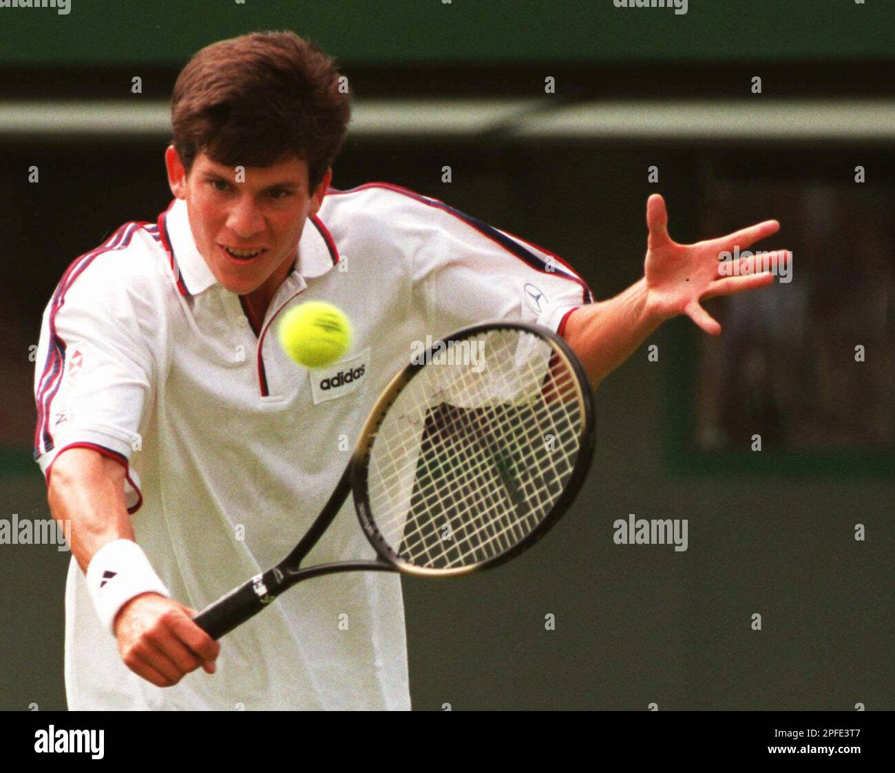Britain's Tim Henman returns to Canada's Daniel Nestor, during their ...