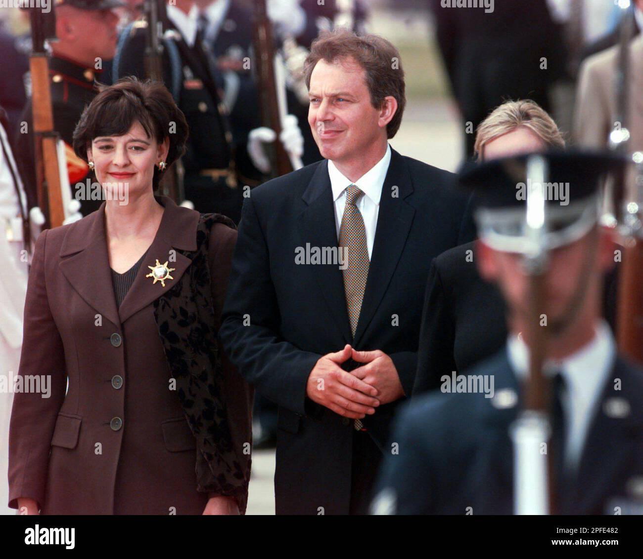 British Prime Minister Tony Blair walks with his wife Cherie Booth ...