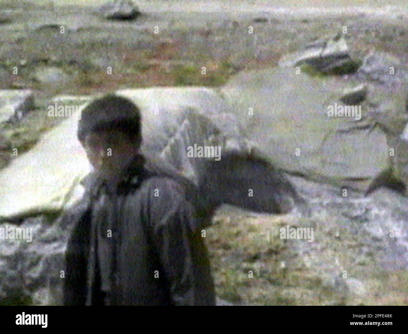 An amateur video image taken at the North Korea/China border June 10 ...