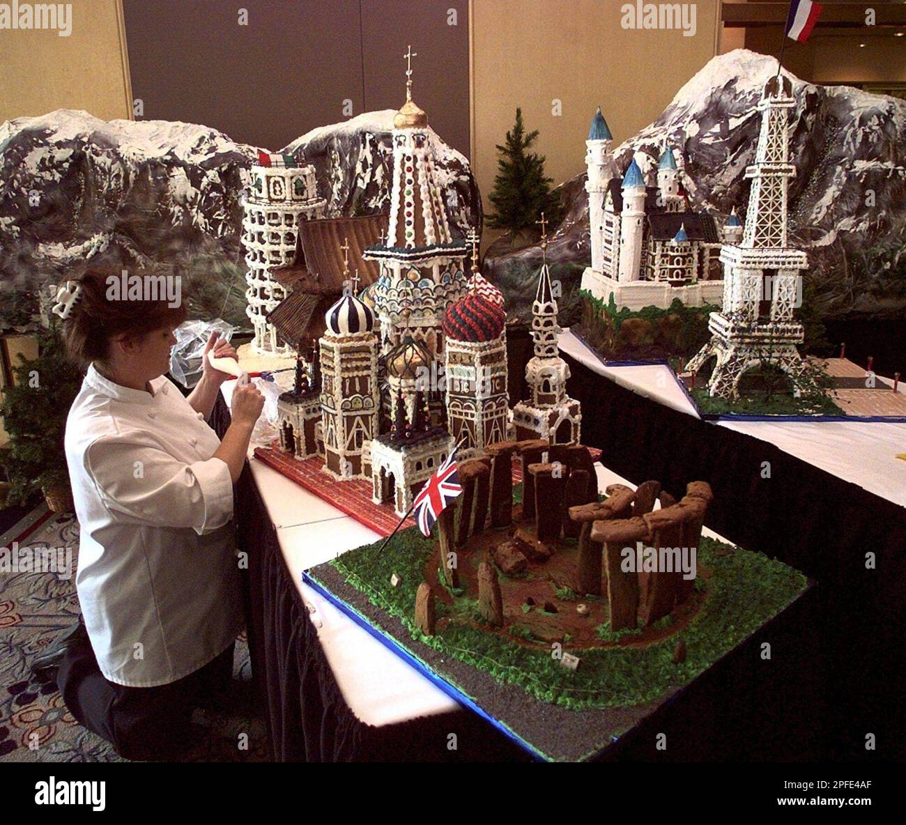 Pastry specialist Vinnie Tomlin puts the finishing touches on a ...