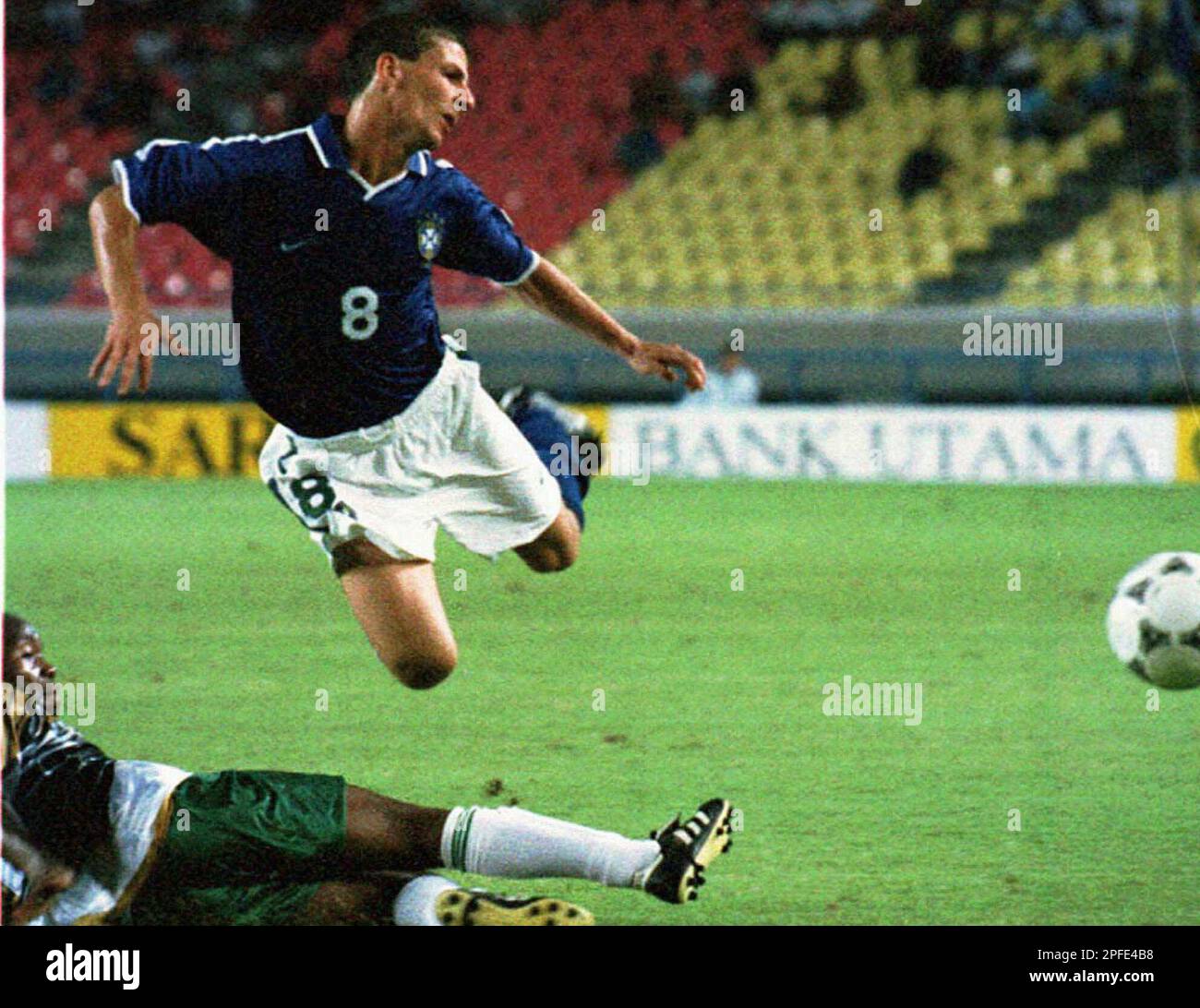 Brazilian Pedro Oliveira goes airborne over South African defender ...