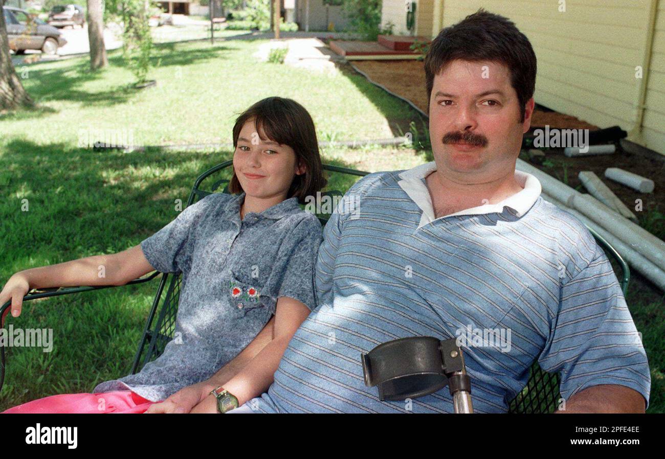 Jim Bunker, pictured with his daughter, Kayla, at their home in Topeka ...