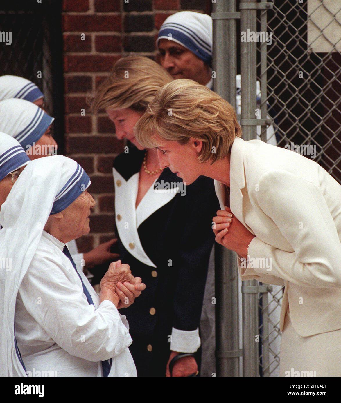 Mother Teresa, left, says goodbye to Princess Diana after receiving a ...