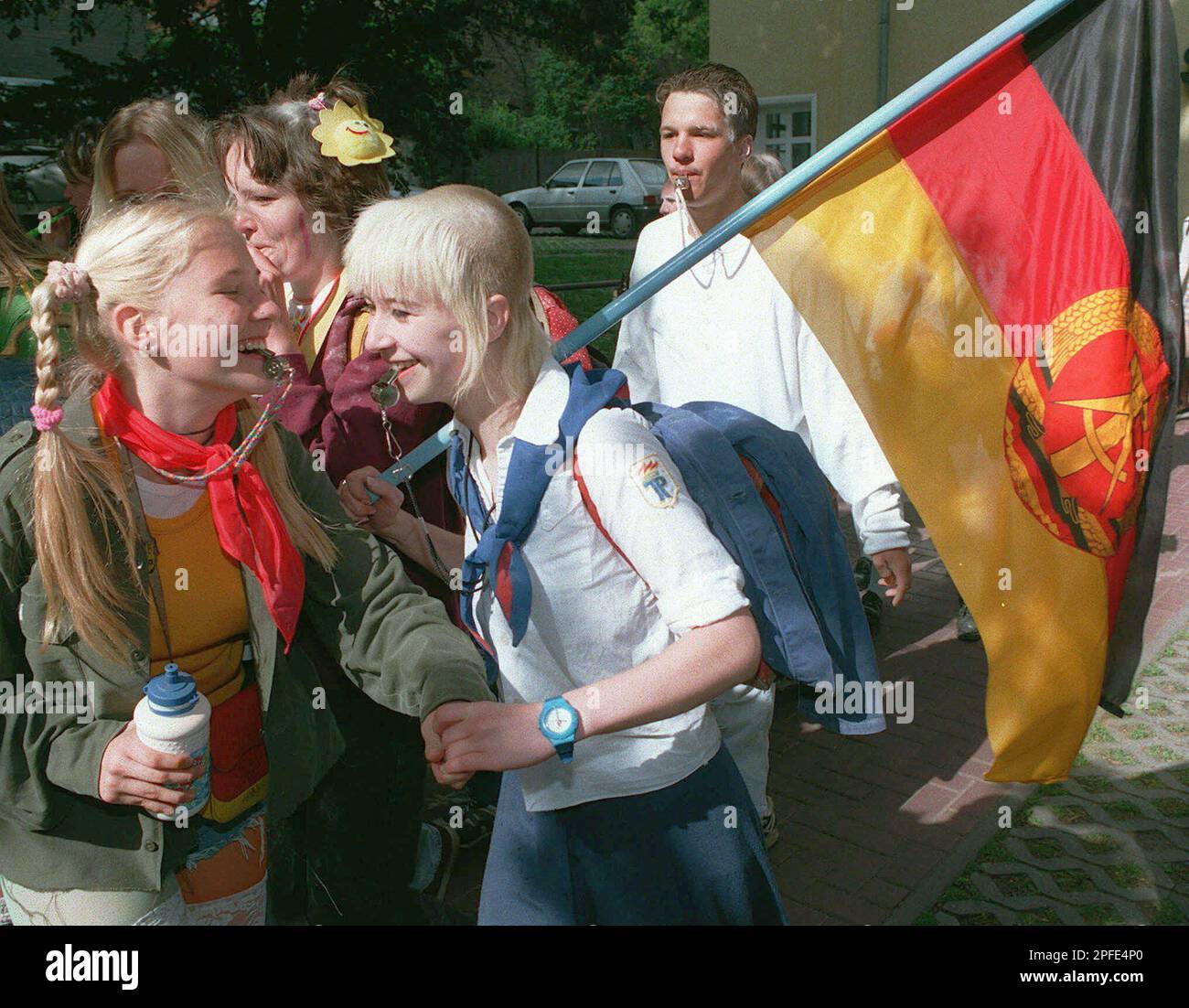 School children dressed up for fun in uniforms of the former East ...