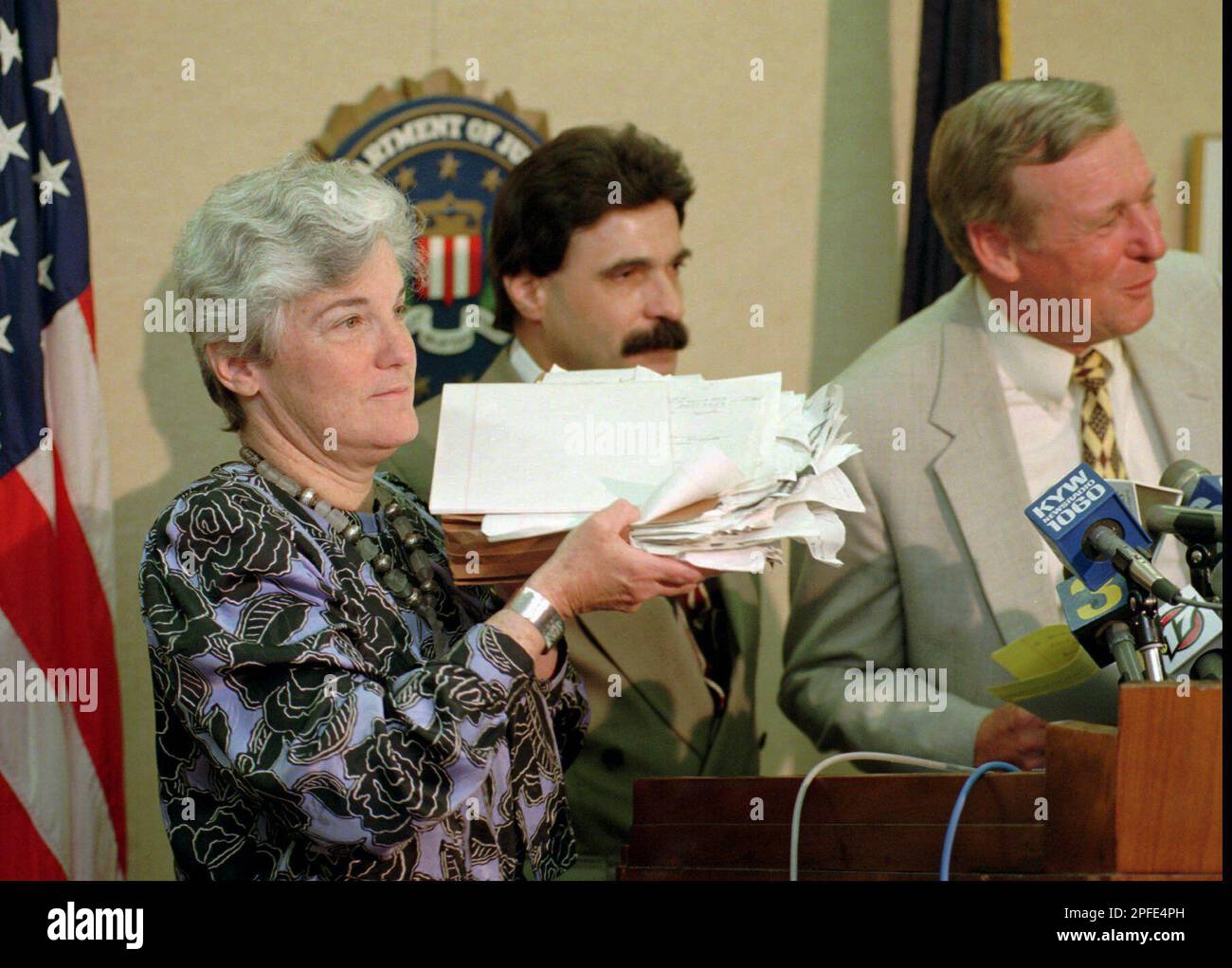Philadelphia District Attorney Lynne Abraham holds a large file stuffed ...