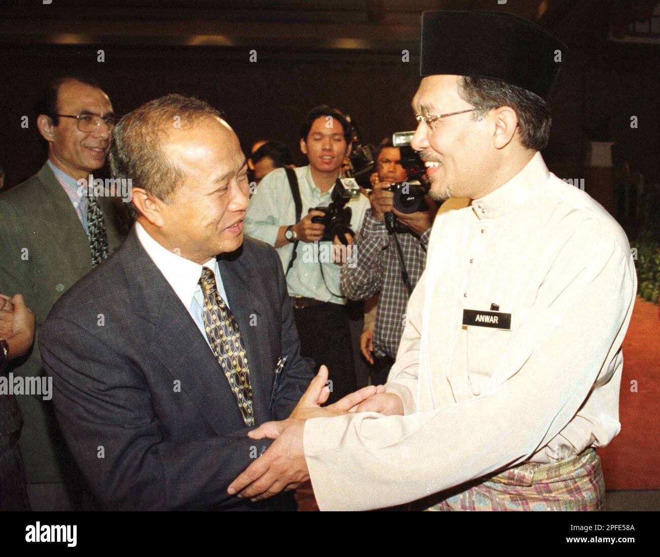 Cambodian First Premier Norodom Ranariddh, left, embraces Malaysia's ...