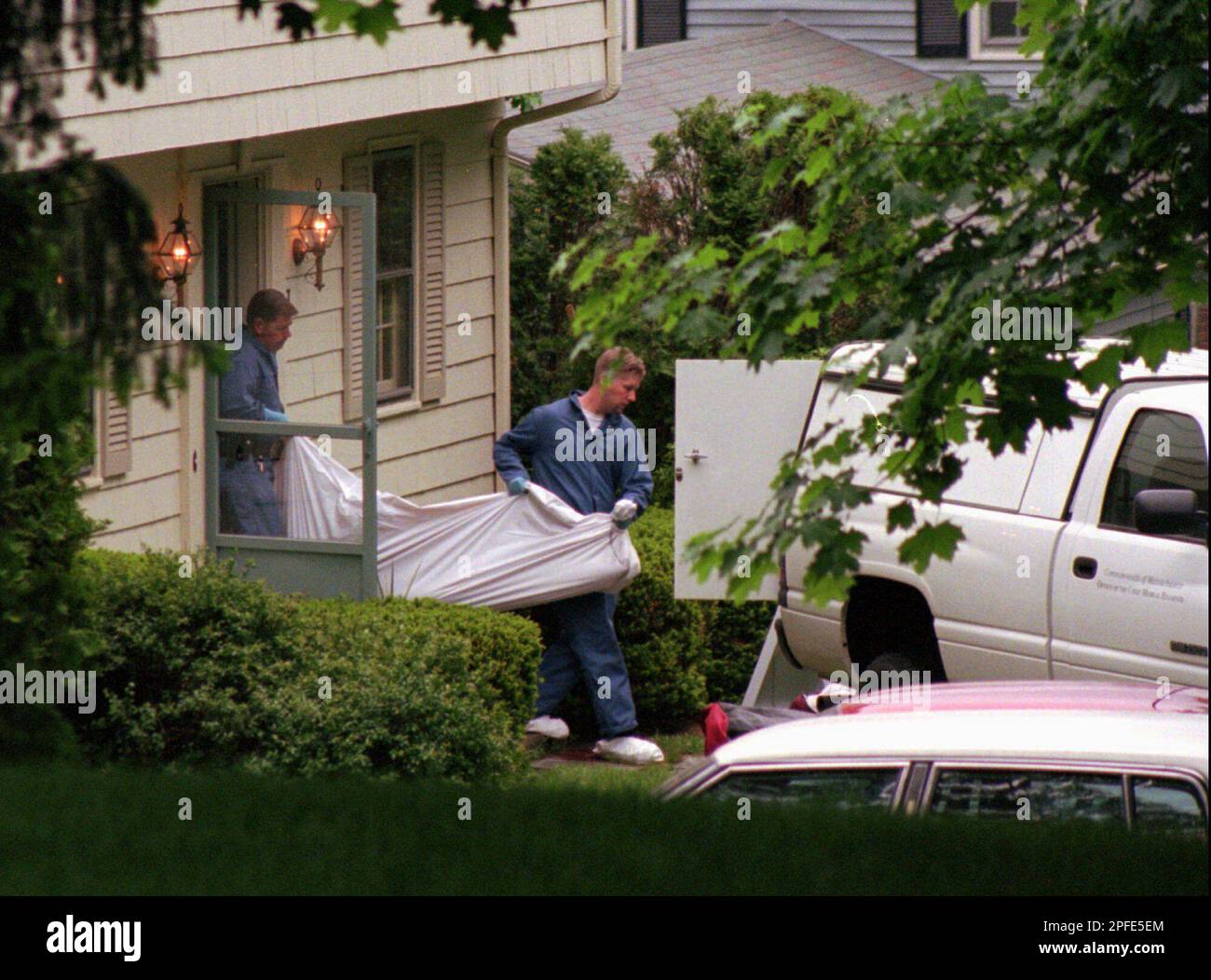 Massachusetts Commonwealth medical examiner officers carry one of the ...