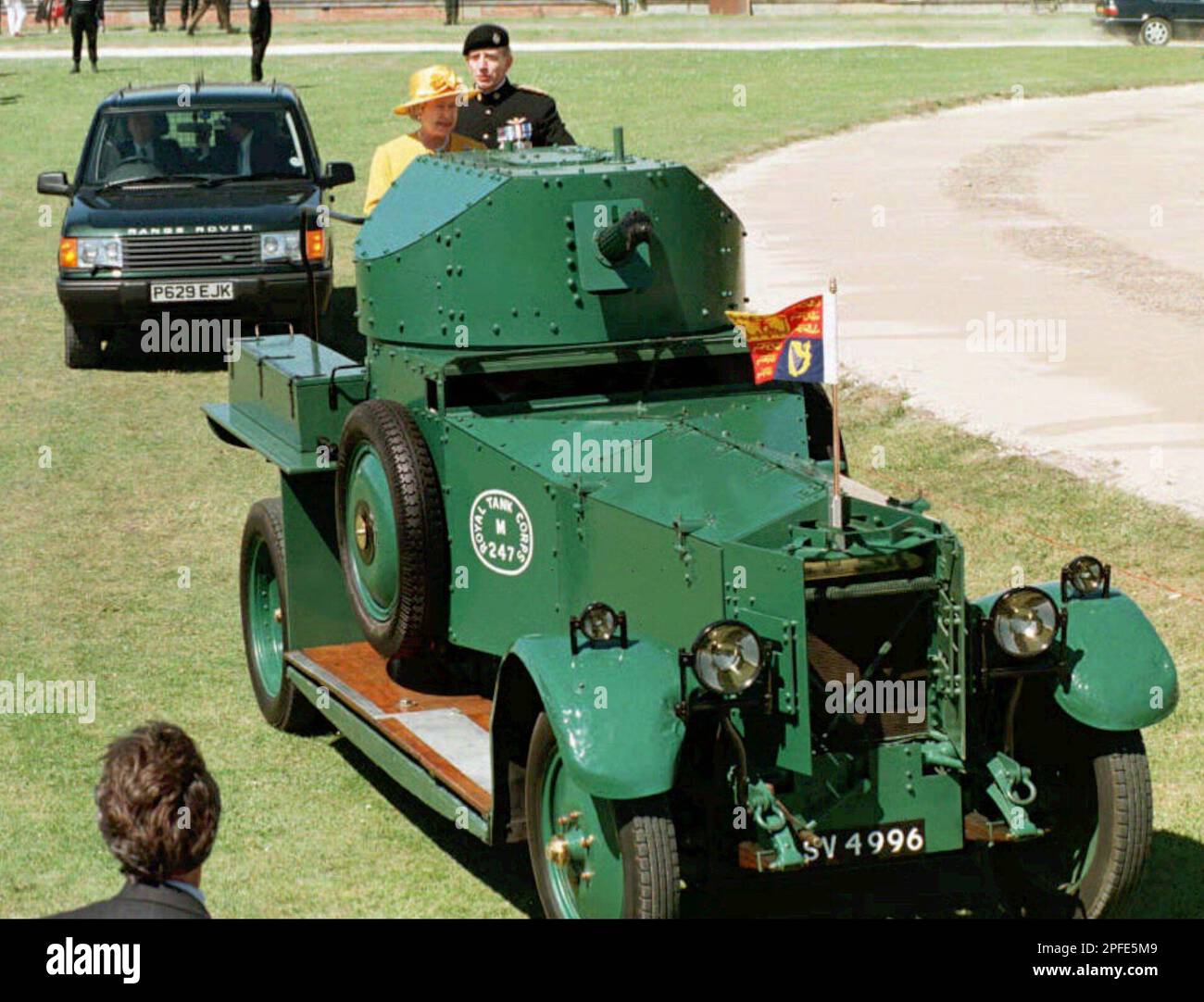 Britain's Queen Elizabeth II is accompanied by the Colonel Commandant ...
