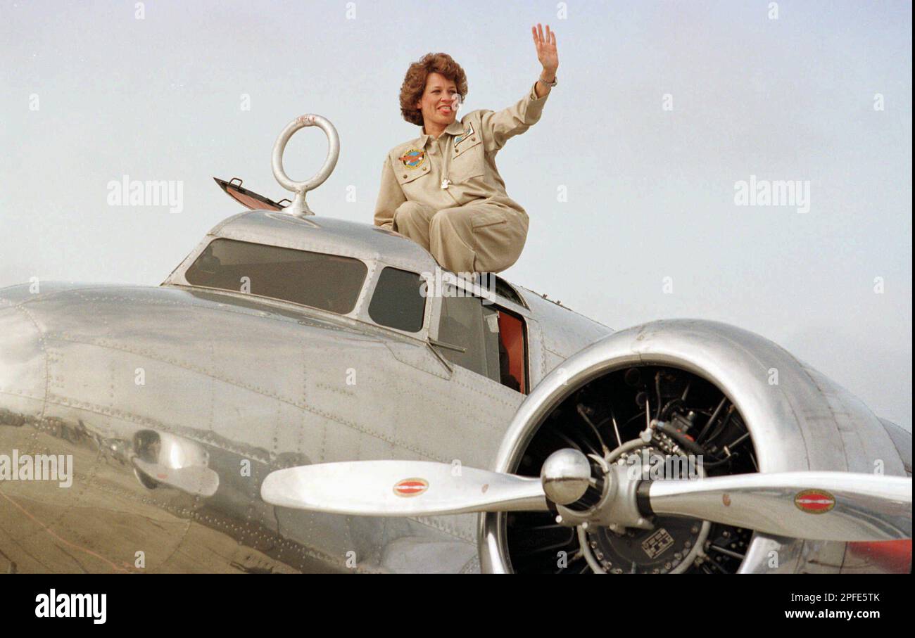 Linda Finch emerges from her Lockheed Electra airplane after her around ...