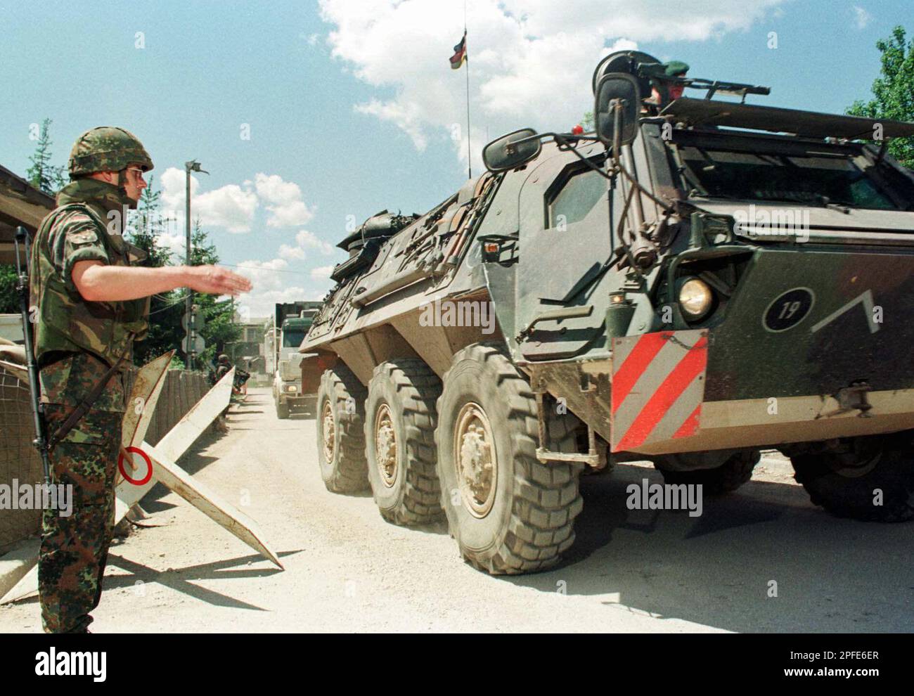 A German armored personnel carrier drives out of its base at Rajlovac ...
