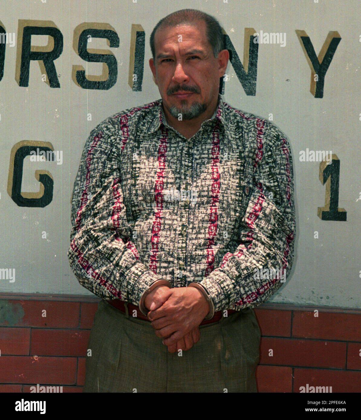 FILE--Colombian drug suspect Justo Pastor Perafan is shown in handcuffs ...