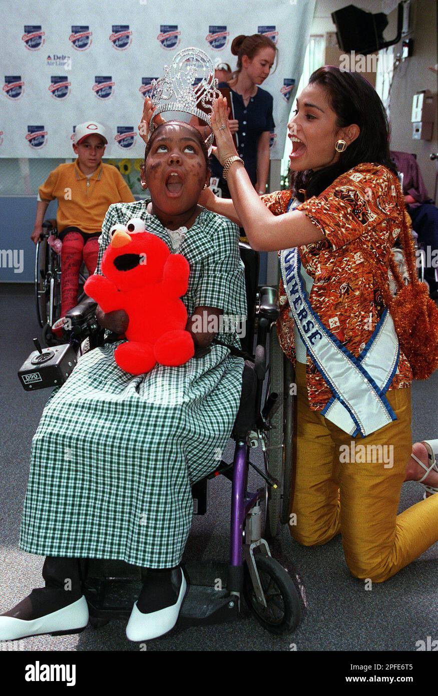 Rakita Dailey, 12, reacts as she is crowned by Miss Universe 1997 ...