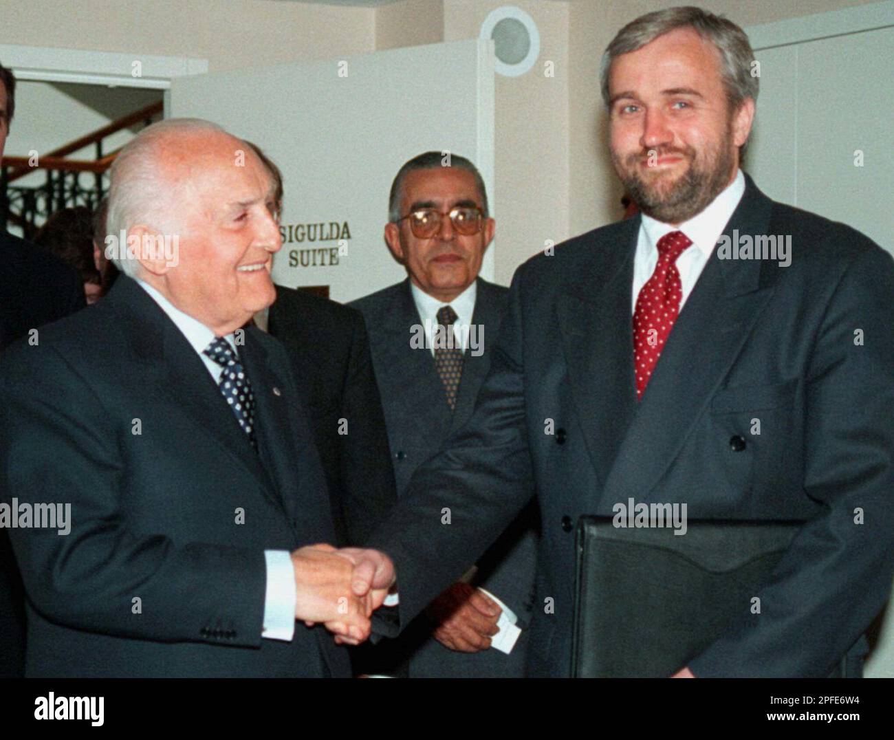 Italian President Oscar Luigi Scalfaro, left, shakes hands with Latvian ...