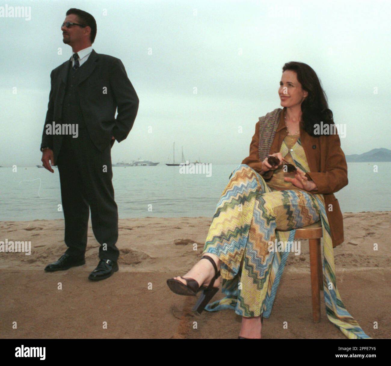 A bodyguard stands by US actress Andie MacDowell waiting for a TV ...