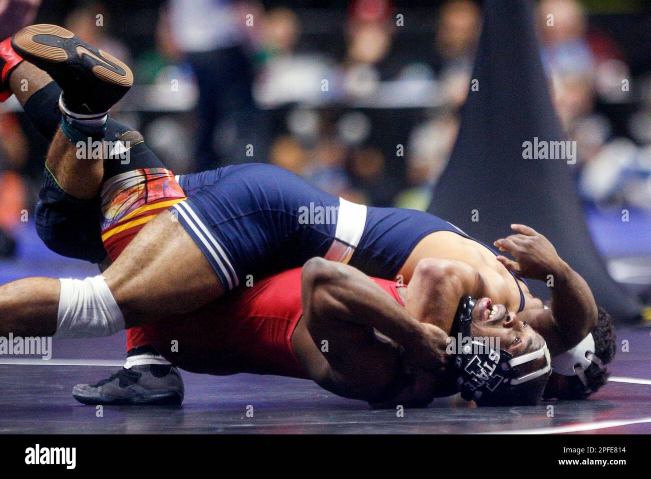Penn State's Shayne Van Ness attempts to pin Iowa State's Paniro ...