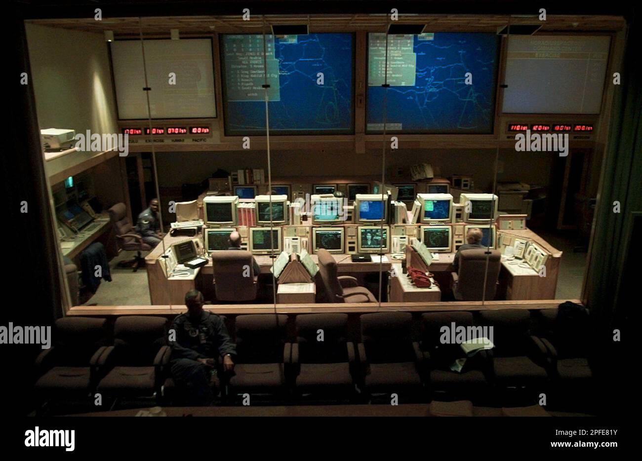 FILE--Large computer screens display maps of the globe inside the main ...