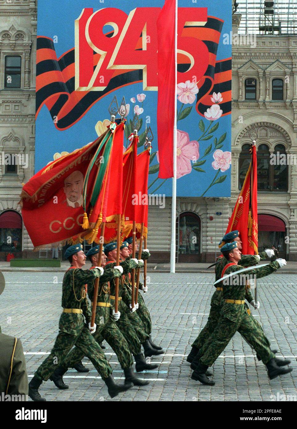 Russian paratroopers carrying Soviet war time banners march across Red ...