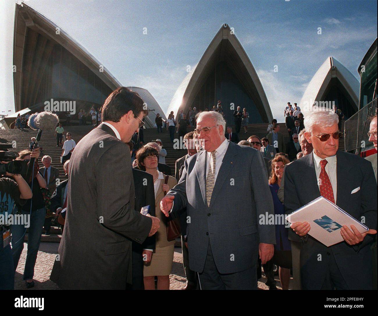 German Chancellor Helmut Kohl, centre, thanks Timothy Jacobs, the Chief ...