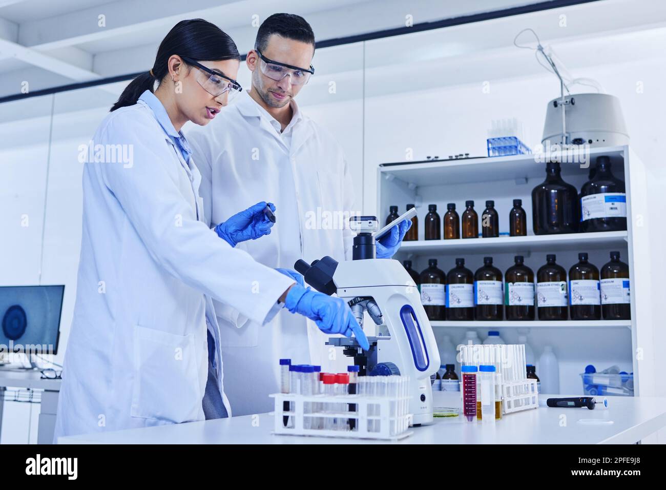 Putting their medical minds together. two young scientists working ...