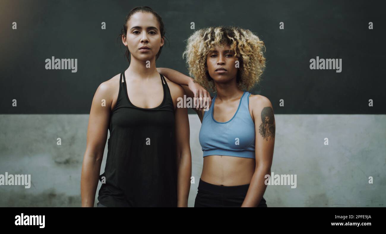 Becoming stronger, fiercer and more powerful. Portrait two sporty young ...