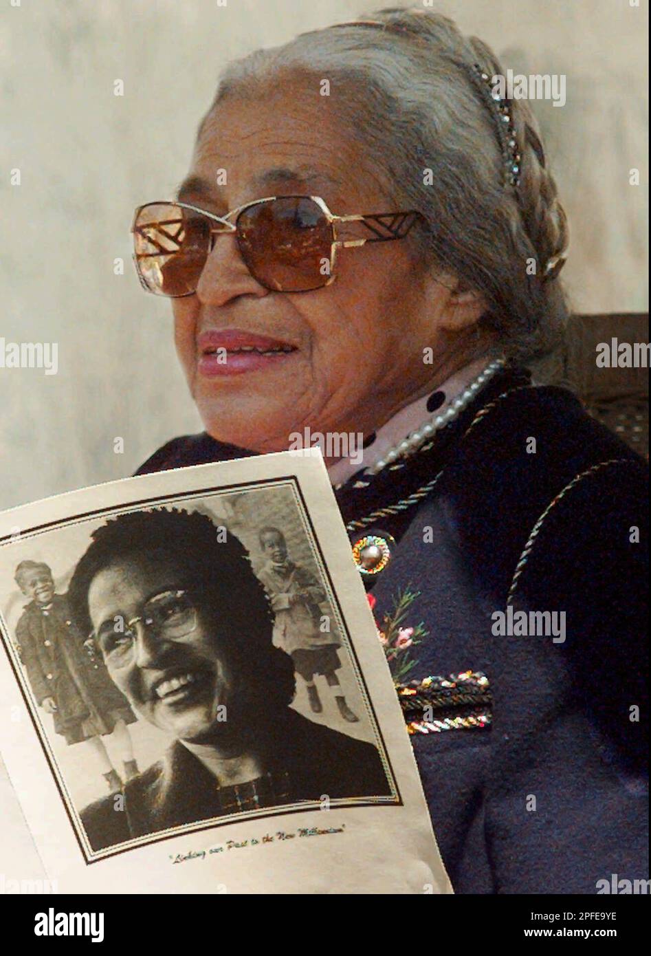 Rosa Parks, 84, holds a program from the Rosa Park Elementary School ...