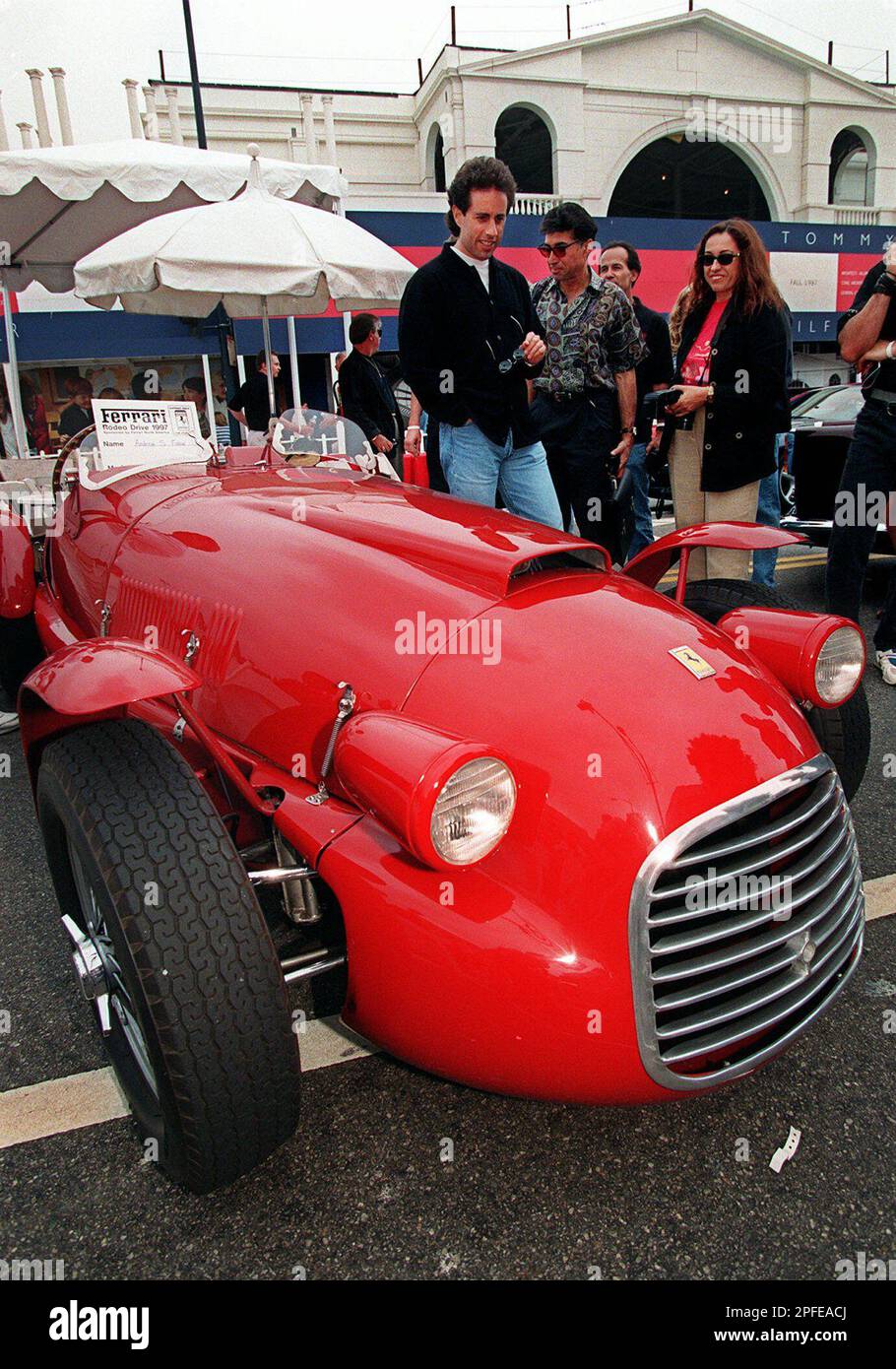 Comedian Jerry Seinfeld looks at a 1947 Ferrari Tipo 166 Spyder Corsa ...