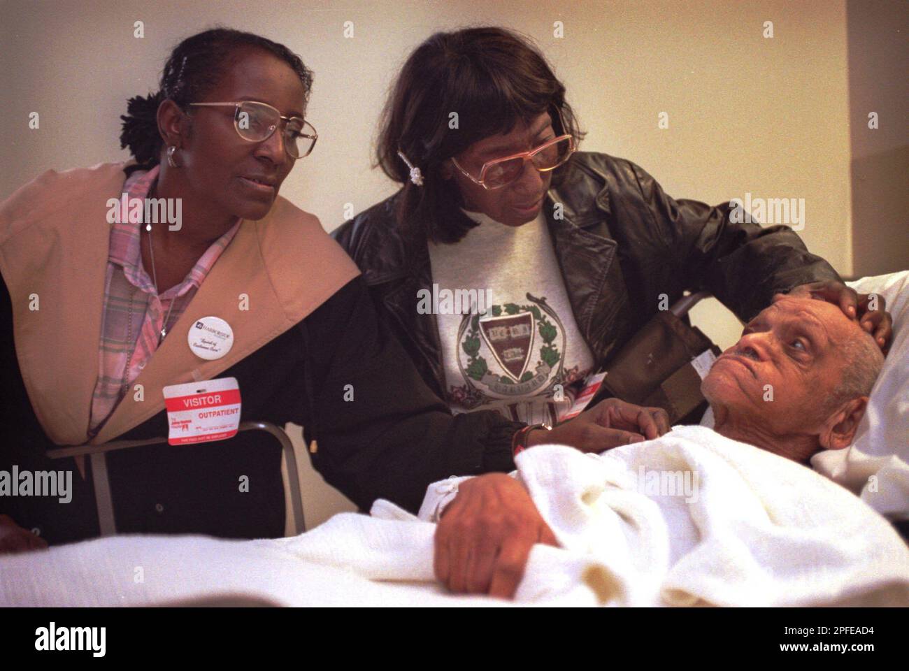 John E. Bell, 115 years old, right, the "Mayor of Oldtown", recovers ...