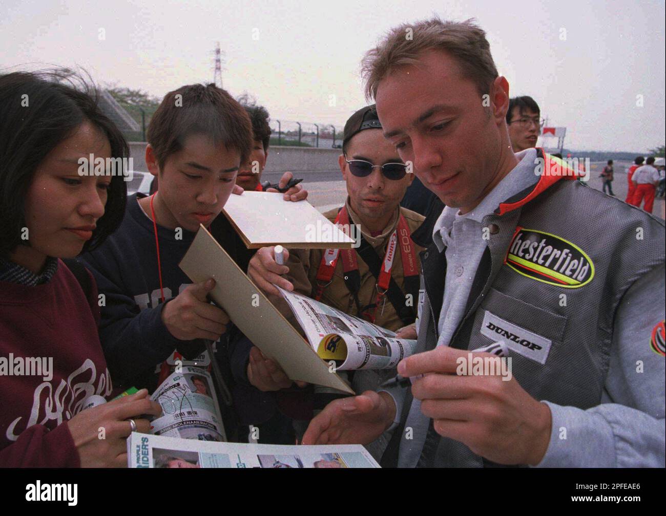 Frenchman Olivier Jacque is surrounded by Japanese signature-hunters ...