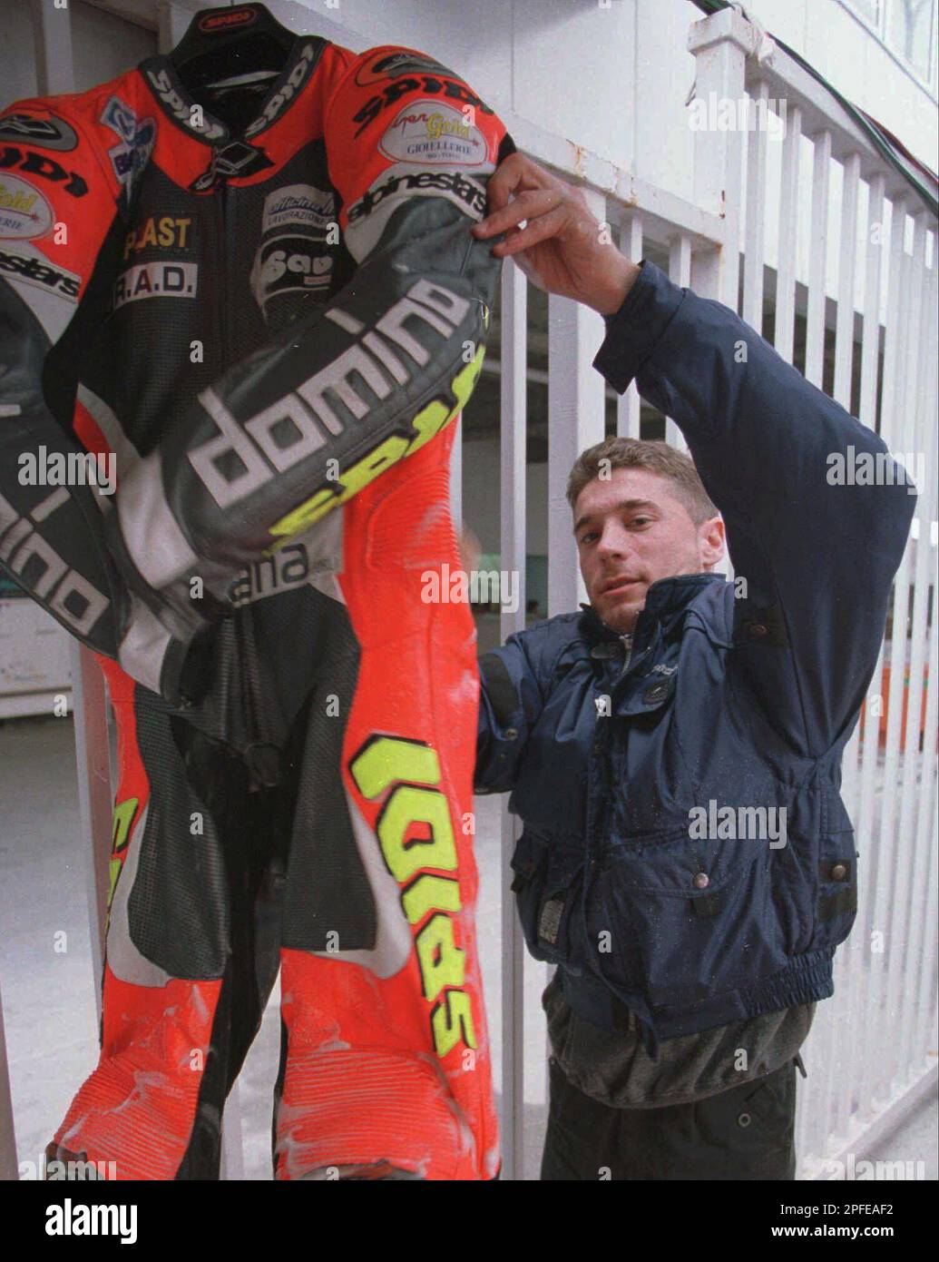 Italian Lucio Cecchinello cleans his racing suit after the first ...