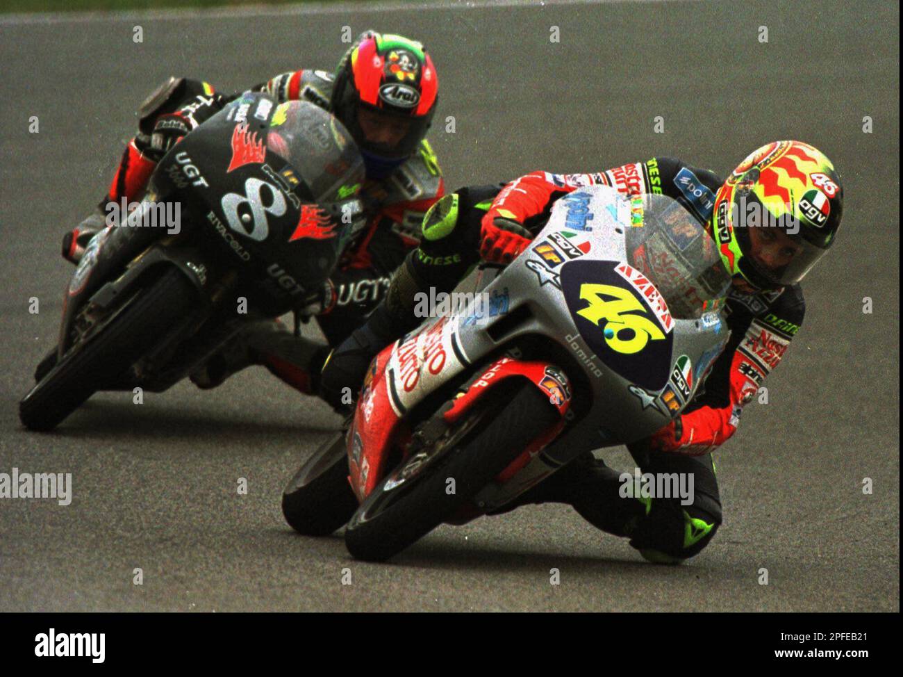 Valentino Rossi of Italy leads Japan's Kazuto Sakata into a corner ...