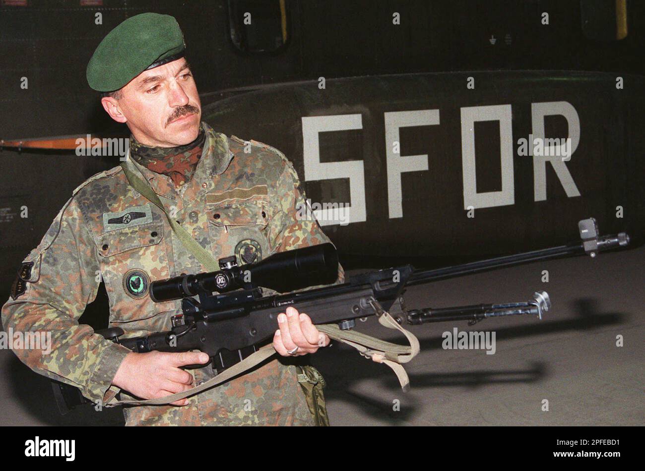 An unidentified German SFOR soldier shows the new anti-sniper rifle ...