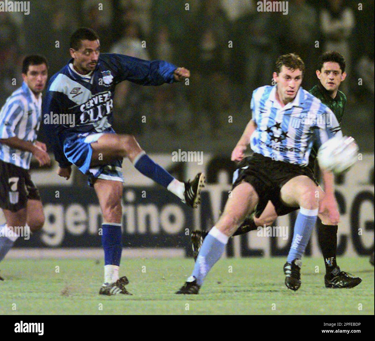 Byron Tenorio, left, of Ecuador s Emelec, shoots the ball against ...