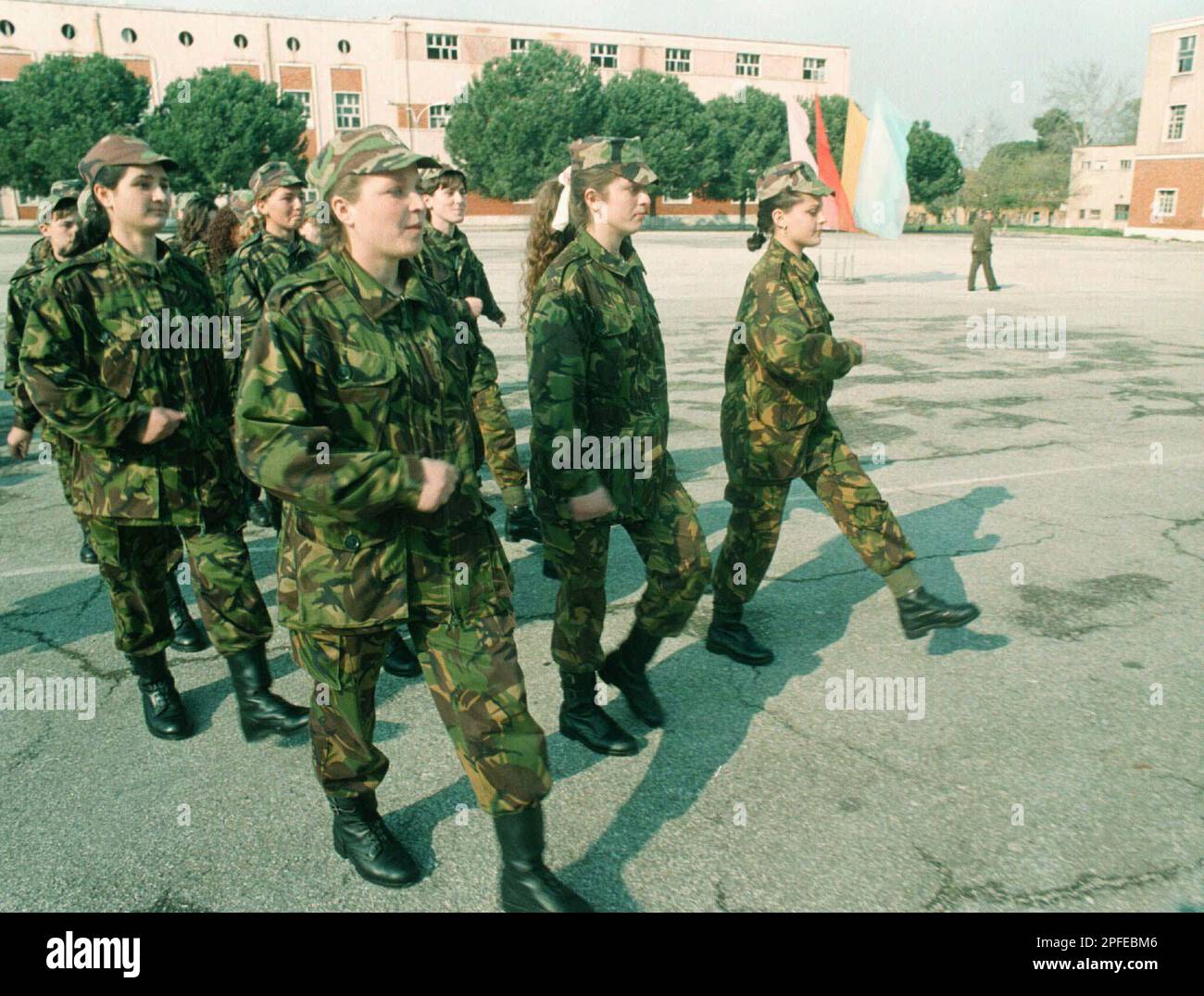 Soldiers march off after a ceremony marking the reopening of the ...