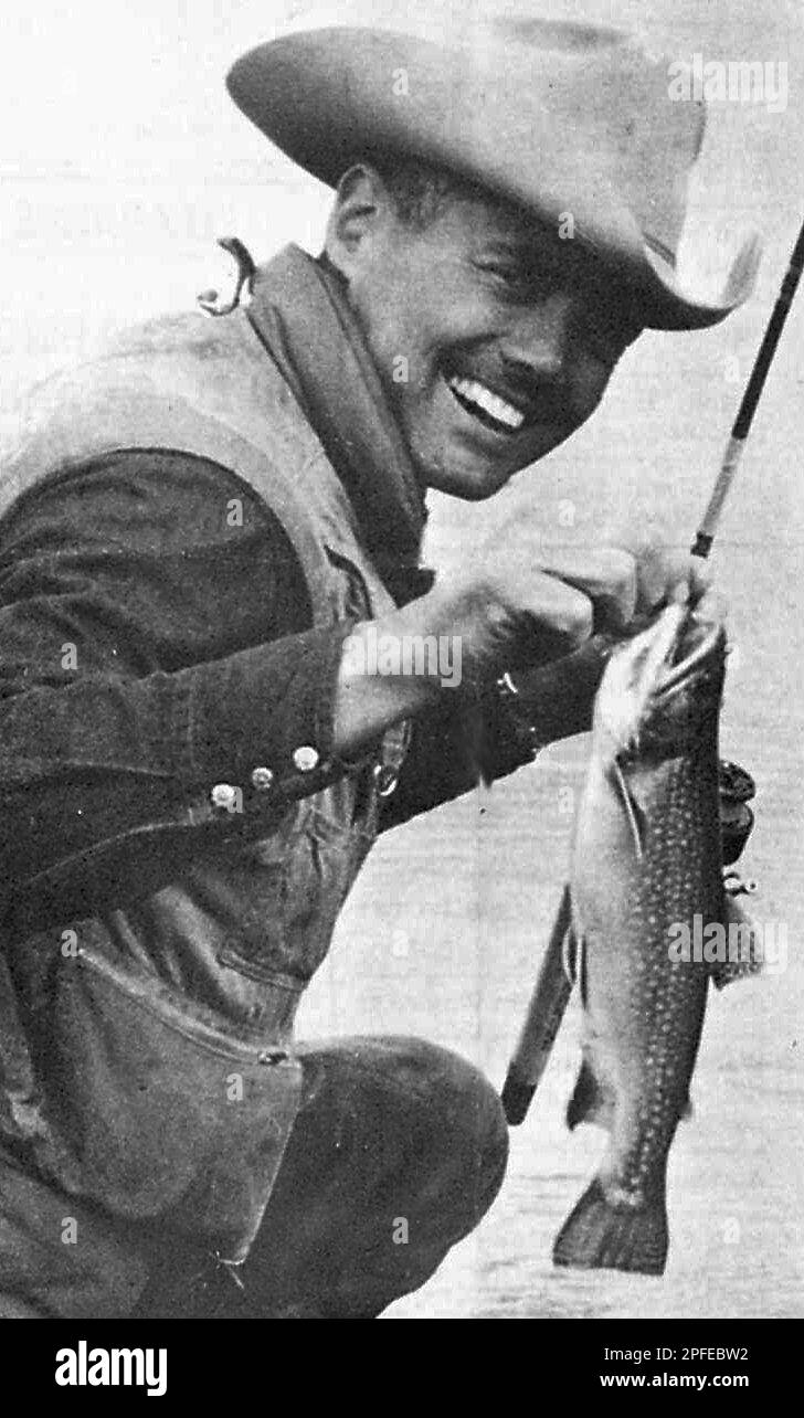 John "Mickey" Craig holds a trout caught in the Ute River near Durango ...