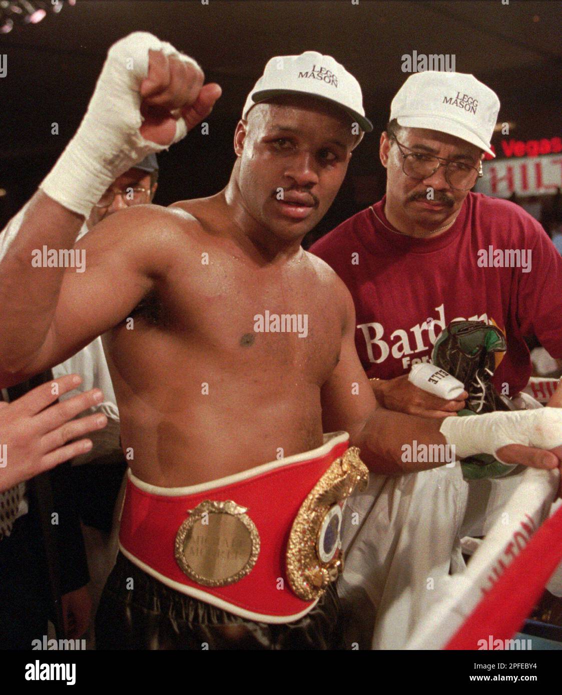 Detroit's Michael Moorer lifts his fist in victory after defeating ...