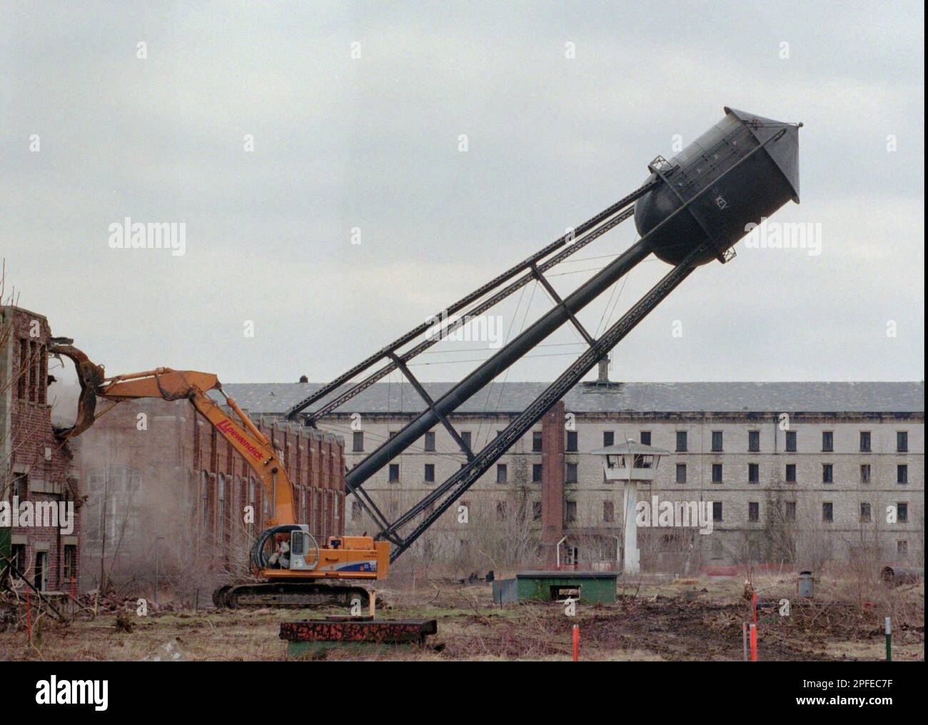 The water tower at the Ohio Penitentiary falls to the ground as its ...