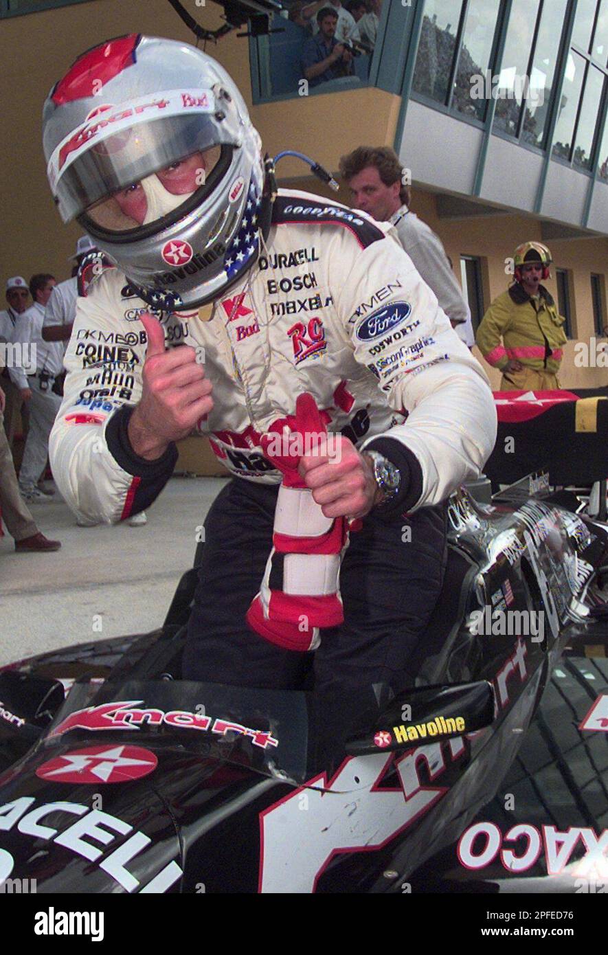 Michael Andretti, of Nazareth, Penn., celebrates as he gets out of his ...