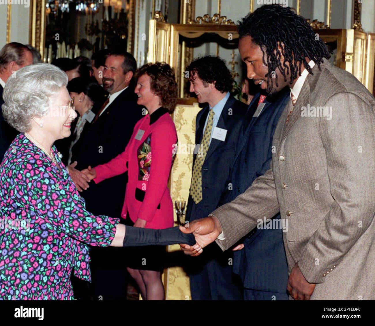 Britain's Queen Elizabeth II greets World Heavyweight boxing champion ...
