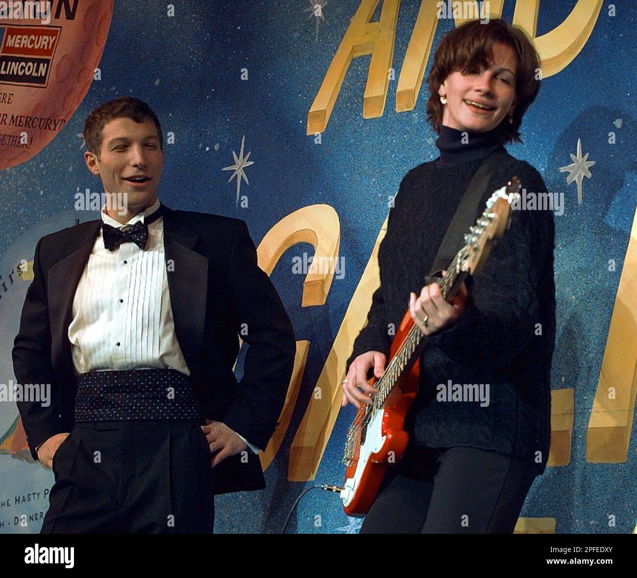 Actress Julia Roberts jams on a guitar as Danton Char looks on at ...