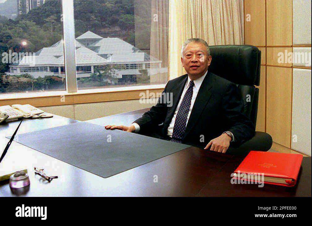 eHong Kong's future leader Tung Chee-hwa sits at his desk in his new ...
